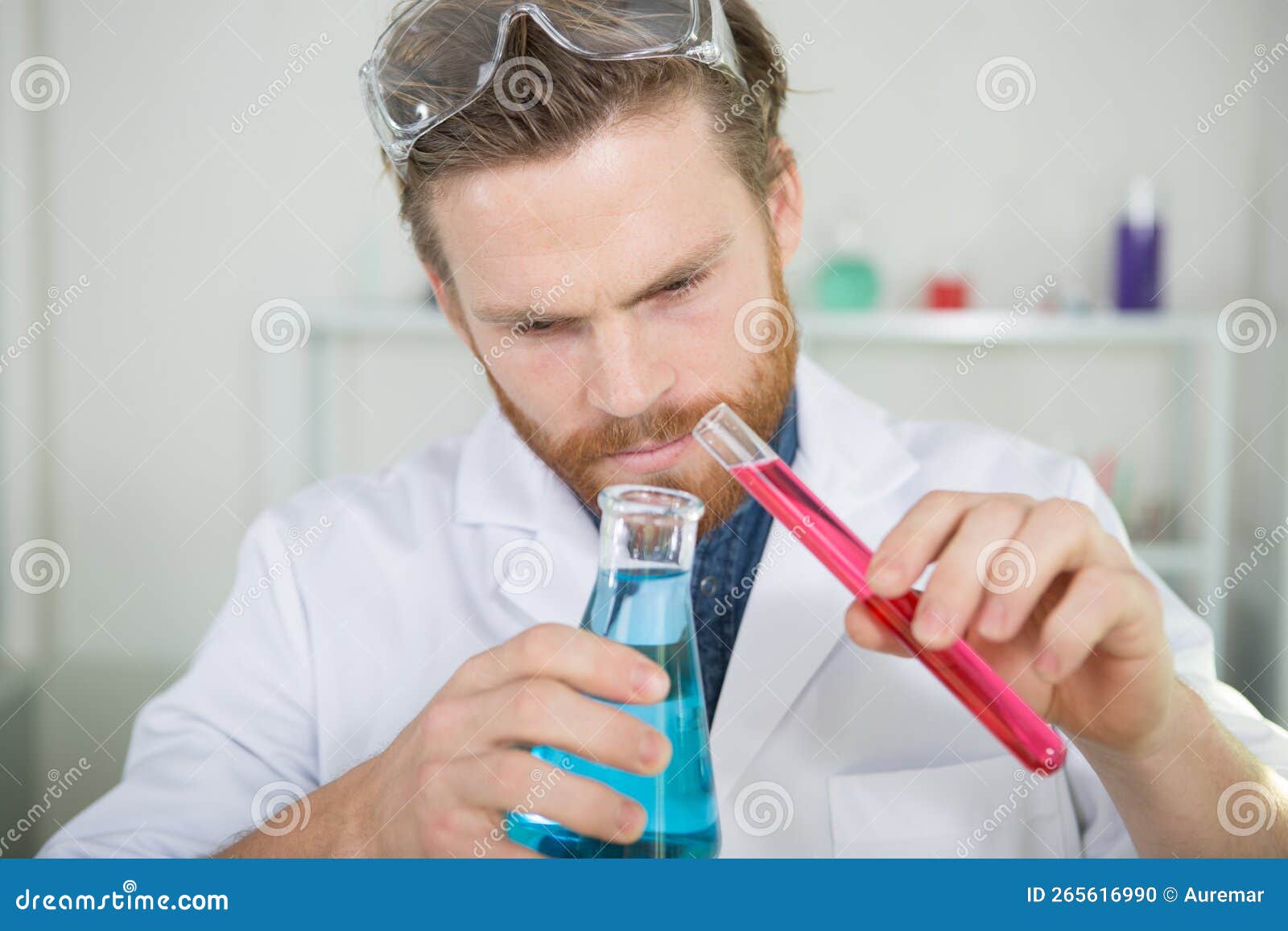 Man in Lab Testing Different Colour Liquids Stock Photo - Image of ...