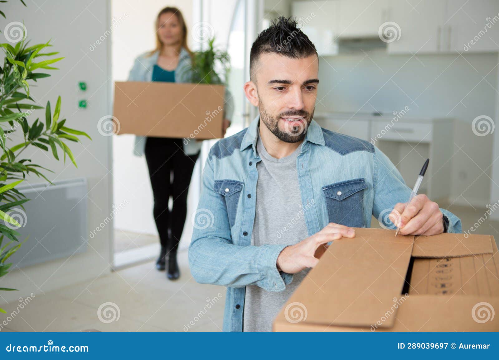 Man Labelling Cardboard Box with Contents Stock Image - Image of ...