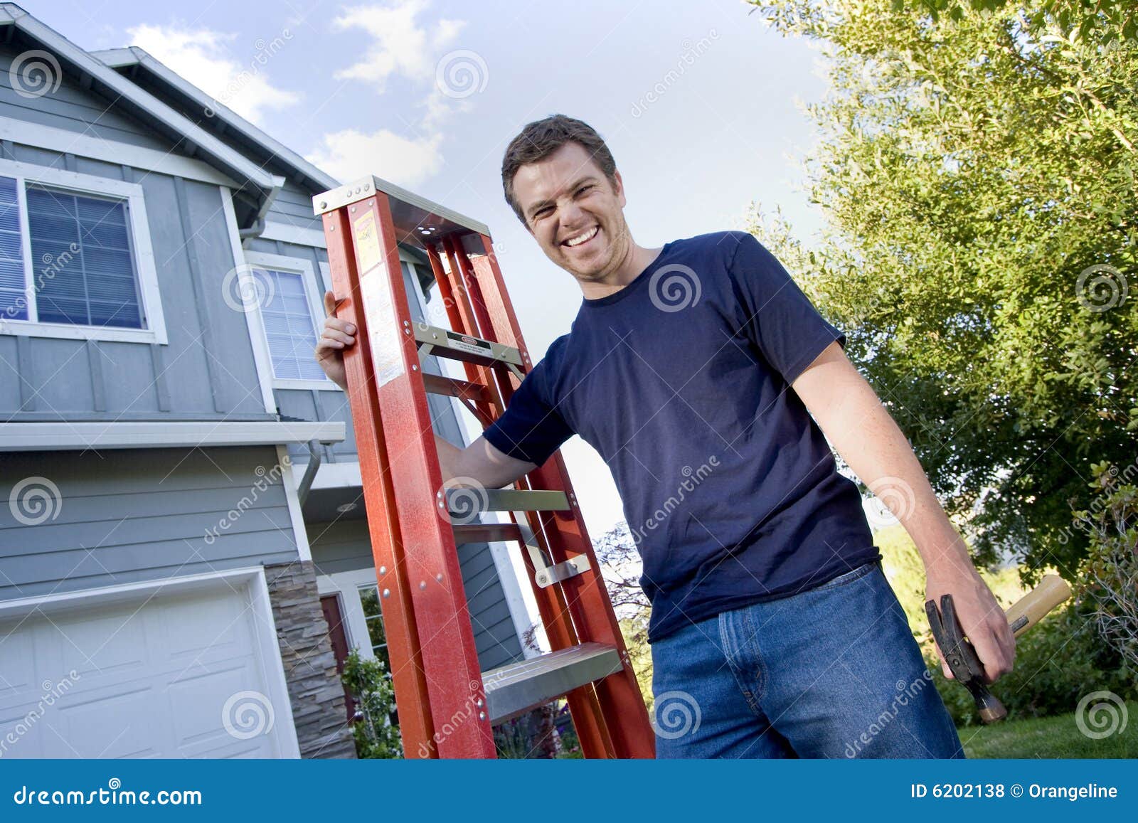 Man with Ladder and Hammer stock photo. Image of brow - 6202138