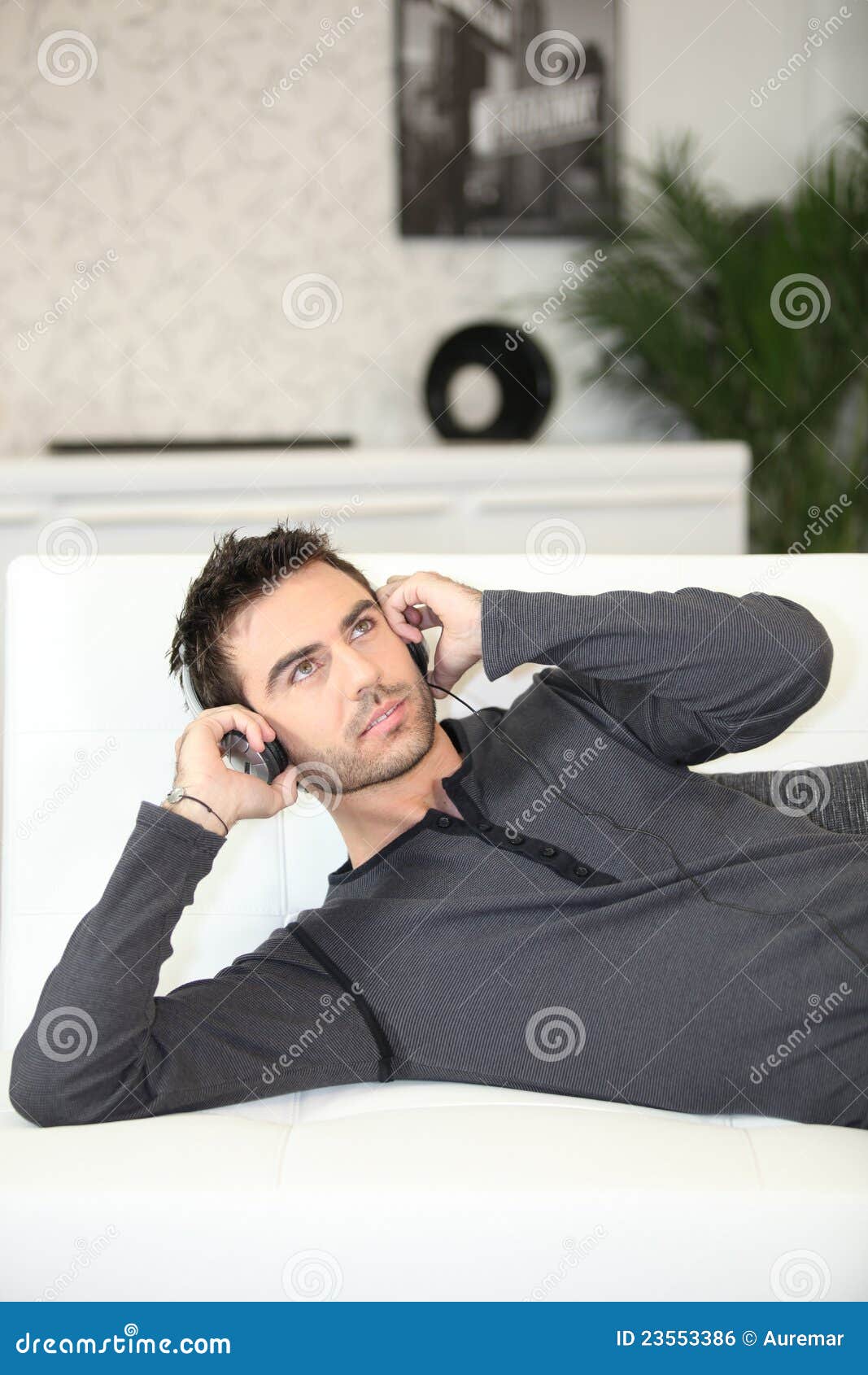 Man laid on a couch stock photo. Image of lively, joyful - 23553386