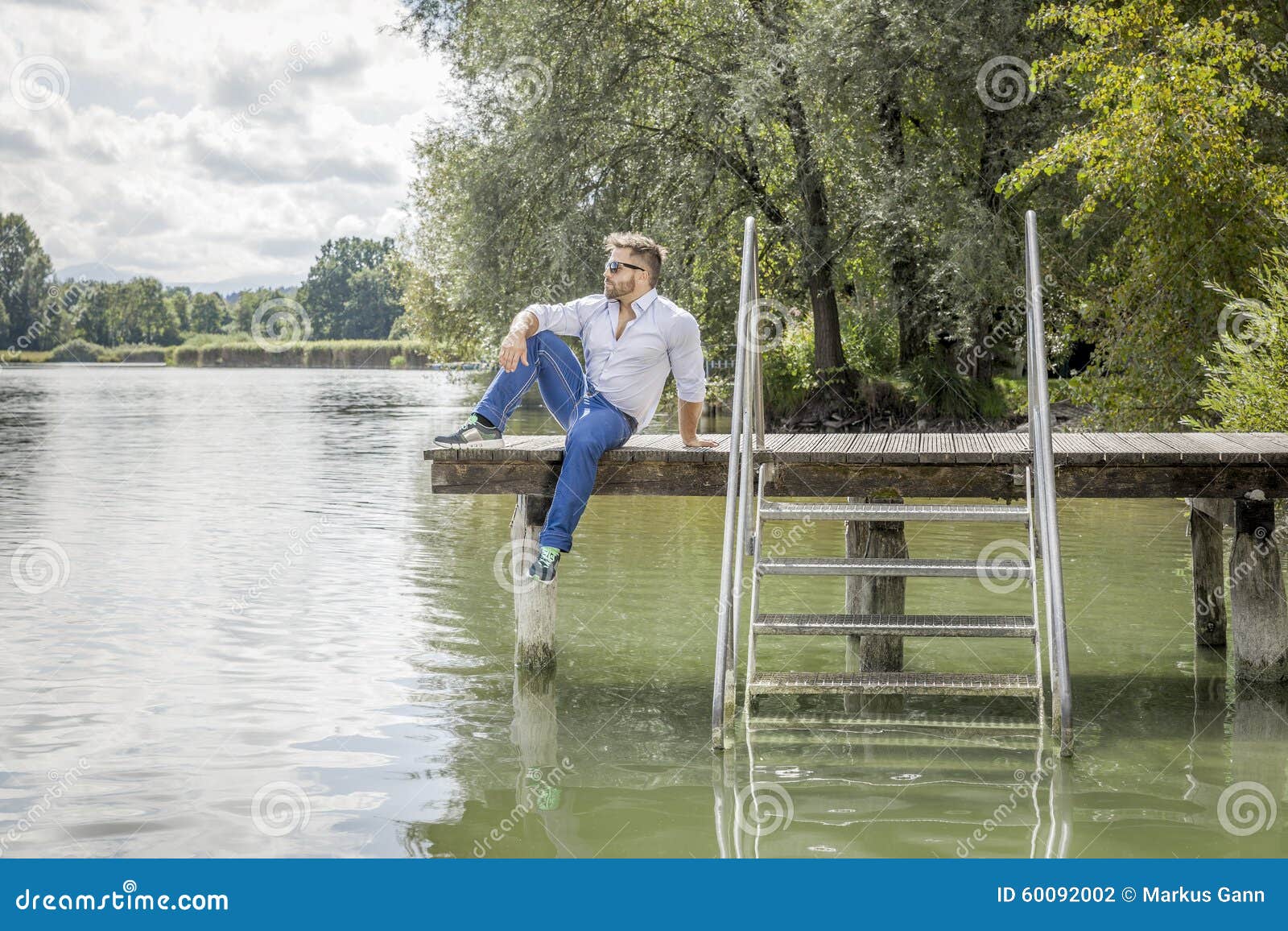 Man at the lake stock photo. Image of freedom, jetty - 60092002