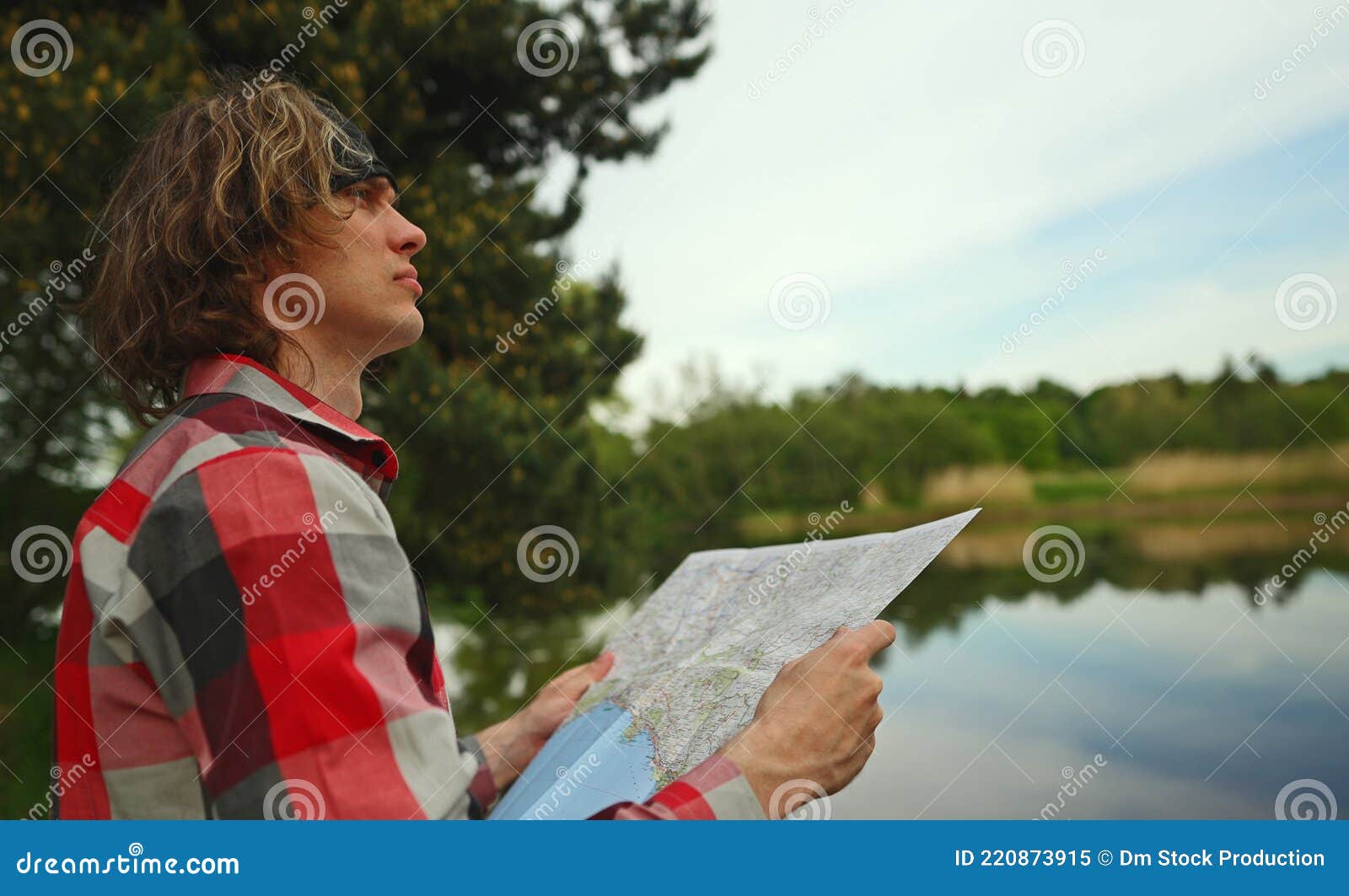 Man by the lake stock image. Image of hiker, planning - 220873915