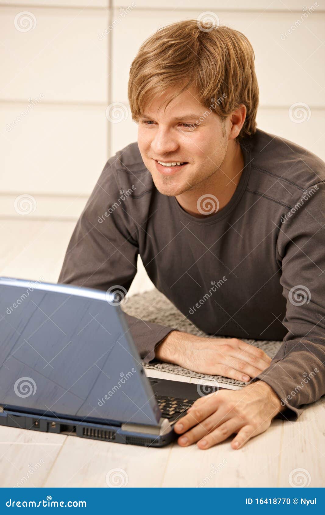 Man with laptop stock photo. Image of floor, camera, casual - 16418770