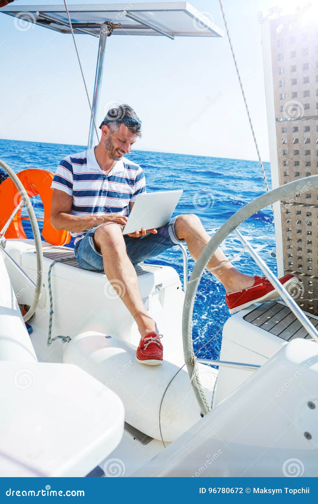 Man with Laptop Computer on Sailboat Stock Photo - Image of crew ...