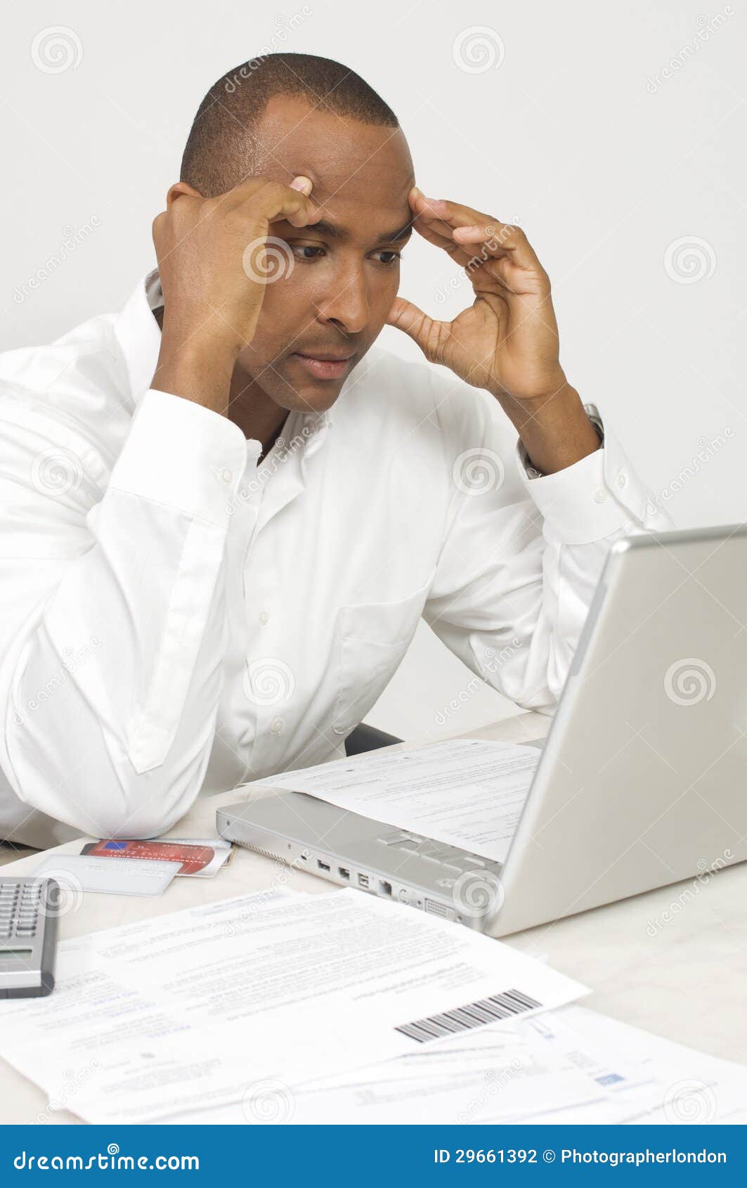 Man with Laptop Figuring Out Bills Stock Photo - Image of distressed ...
