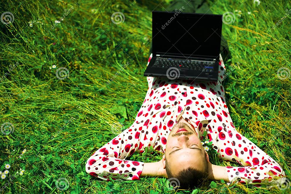 Man with laptop on grass stock image. Image of computers - 5628767
