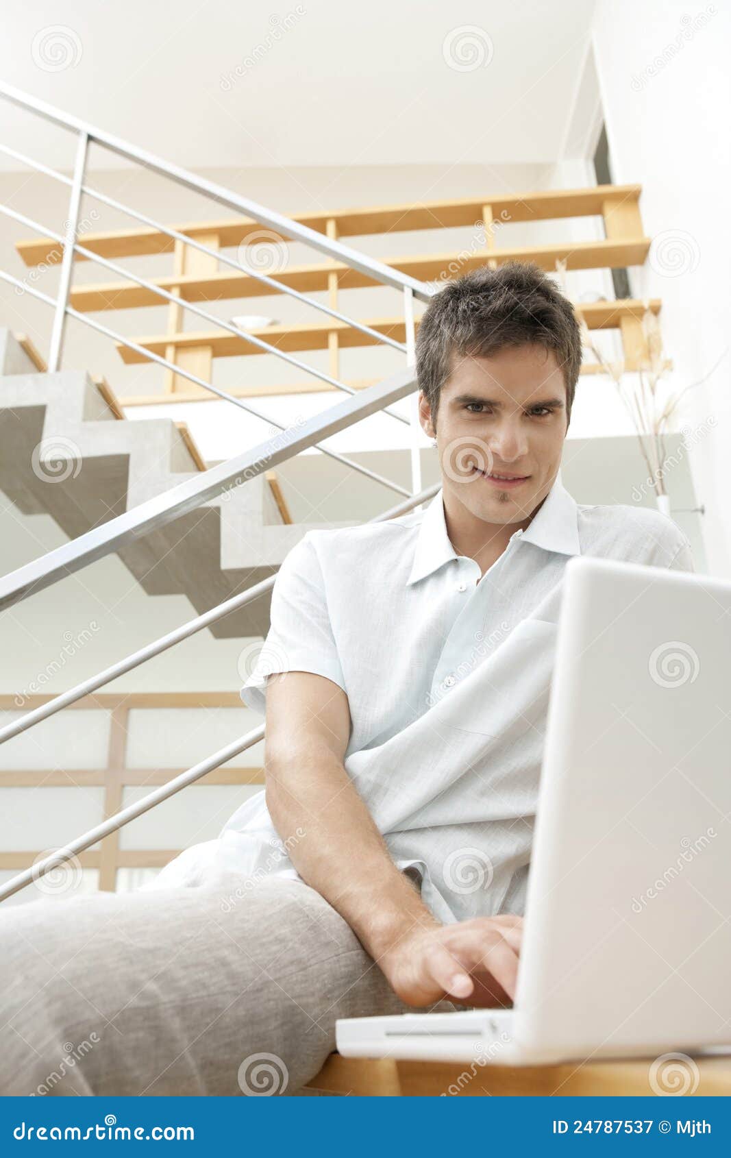Man with Laptop on Stairs stock image. Image of connectivity - 24787537