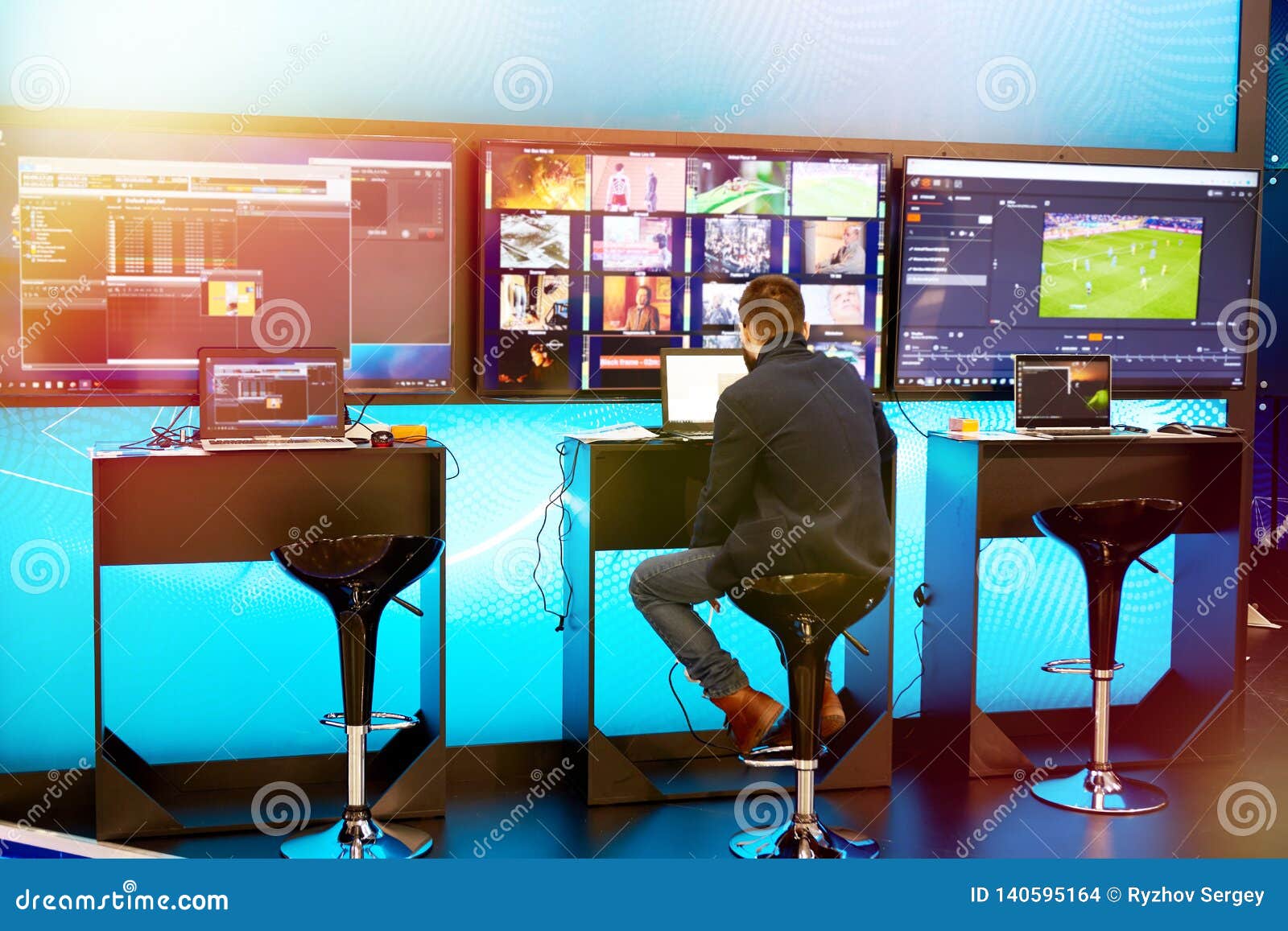 Man with Laptop and Television Monitors Editorial Stock Image - Image ...