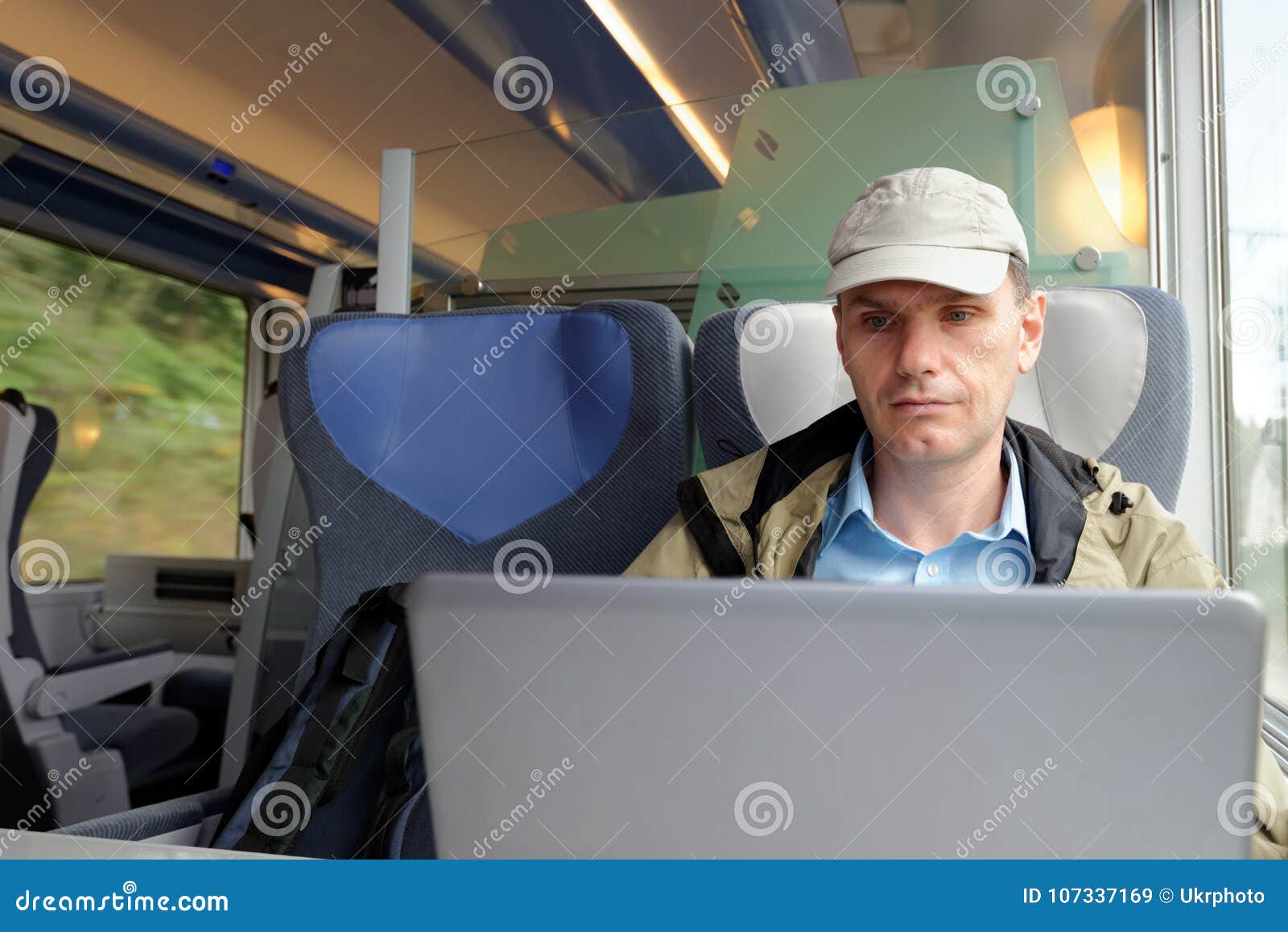 Man with laptop in a train stock image. Image of train - 107337169