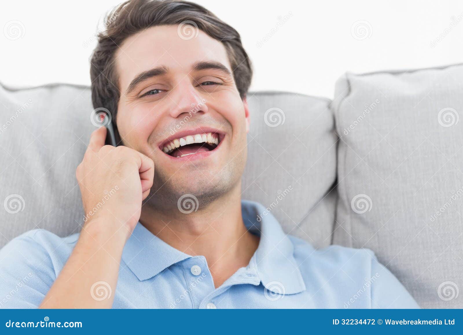 Man Laughing while Having a Phone Conversation Stock Photo - Image of ...