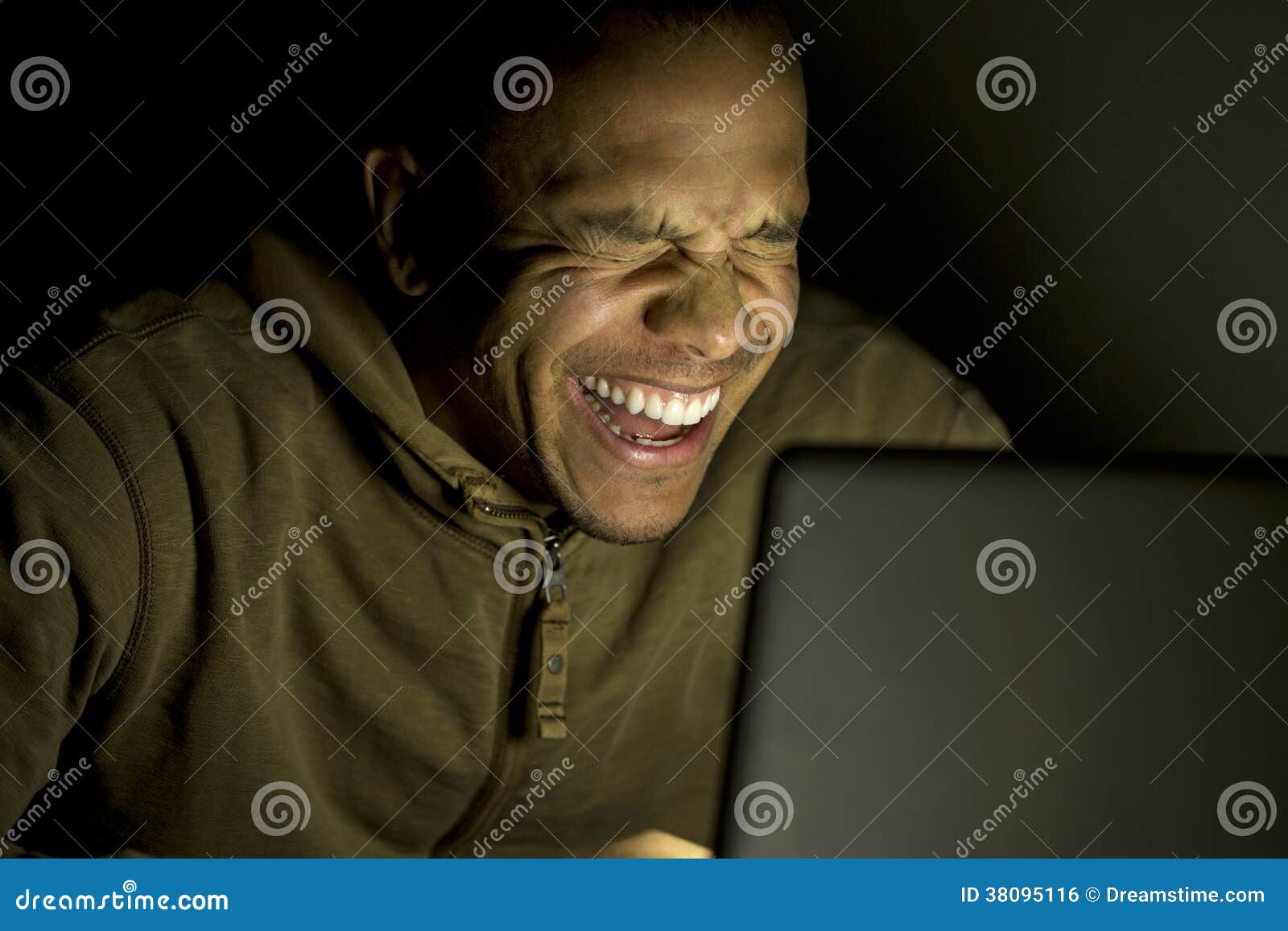 Man Laughing at His Laptop at Night Stock Photo - Image of darkness ...
