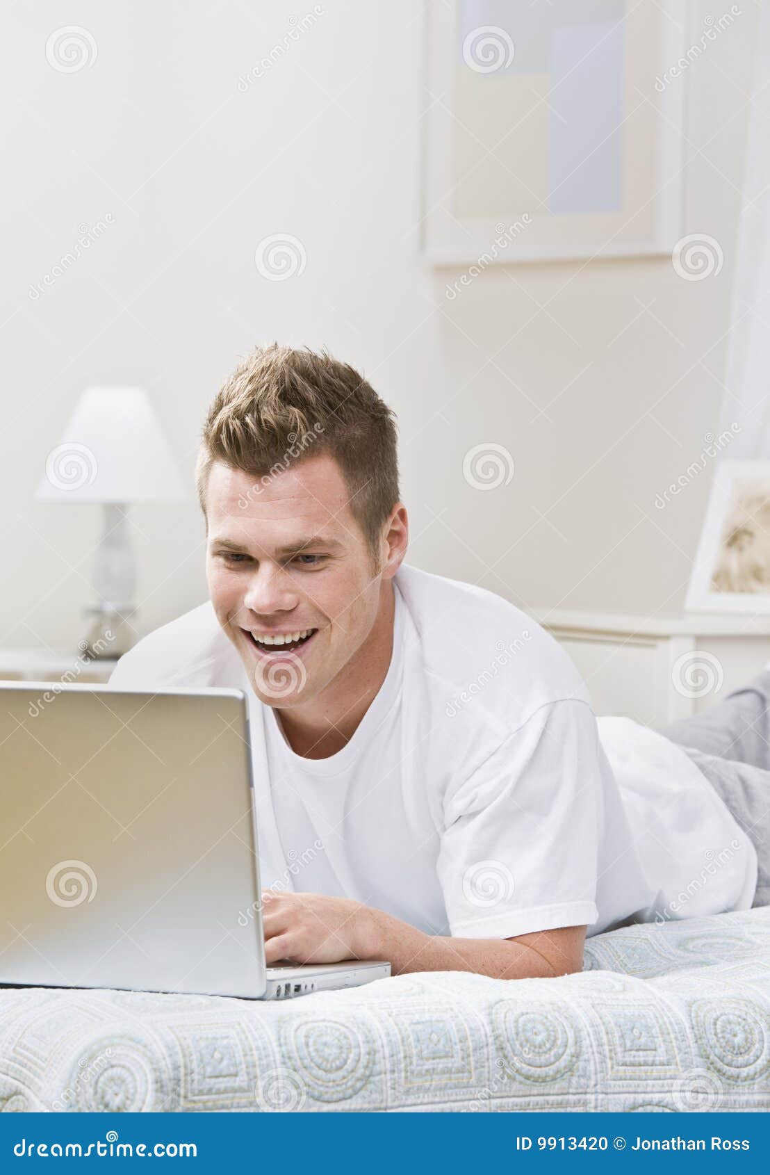 Man Laughing at Laptop stock photo. Image of mischief - 9913420