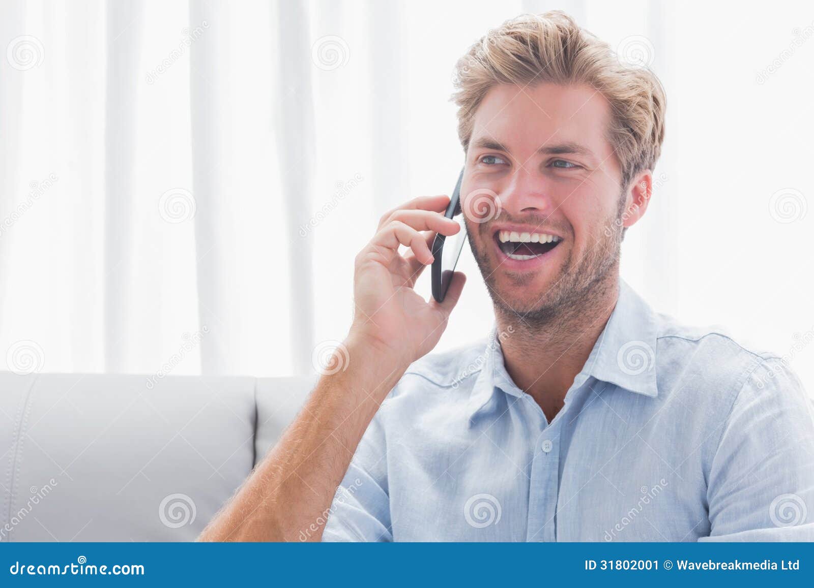 Man Laughing while he is on the Phone Stock Image - Image of apartment ...