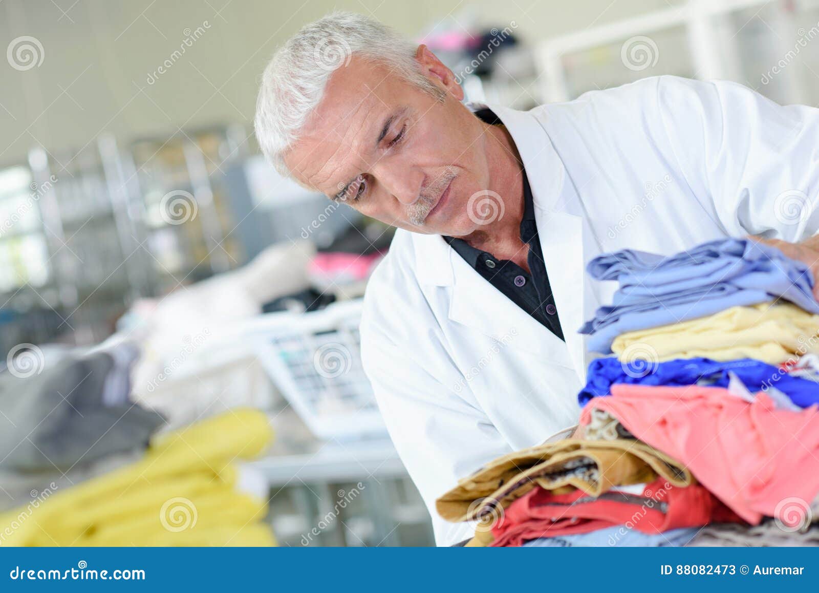 Man in Laundry with Pile Washing Stock Image - Image of laundrette ...