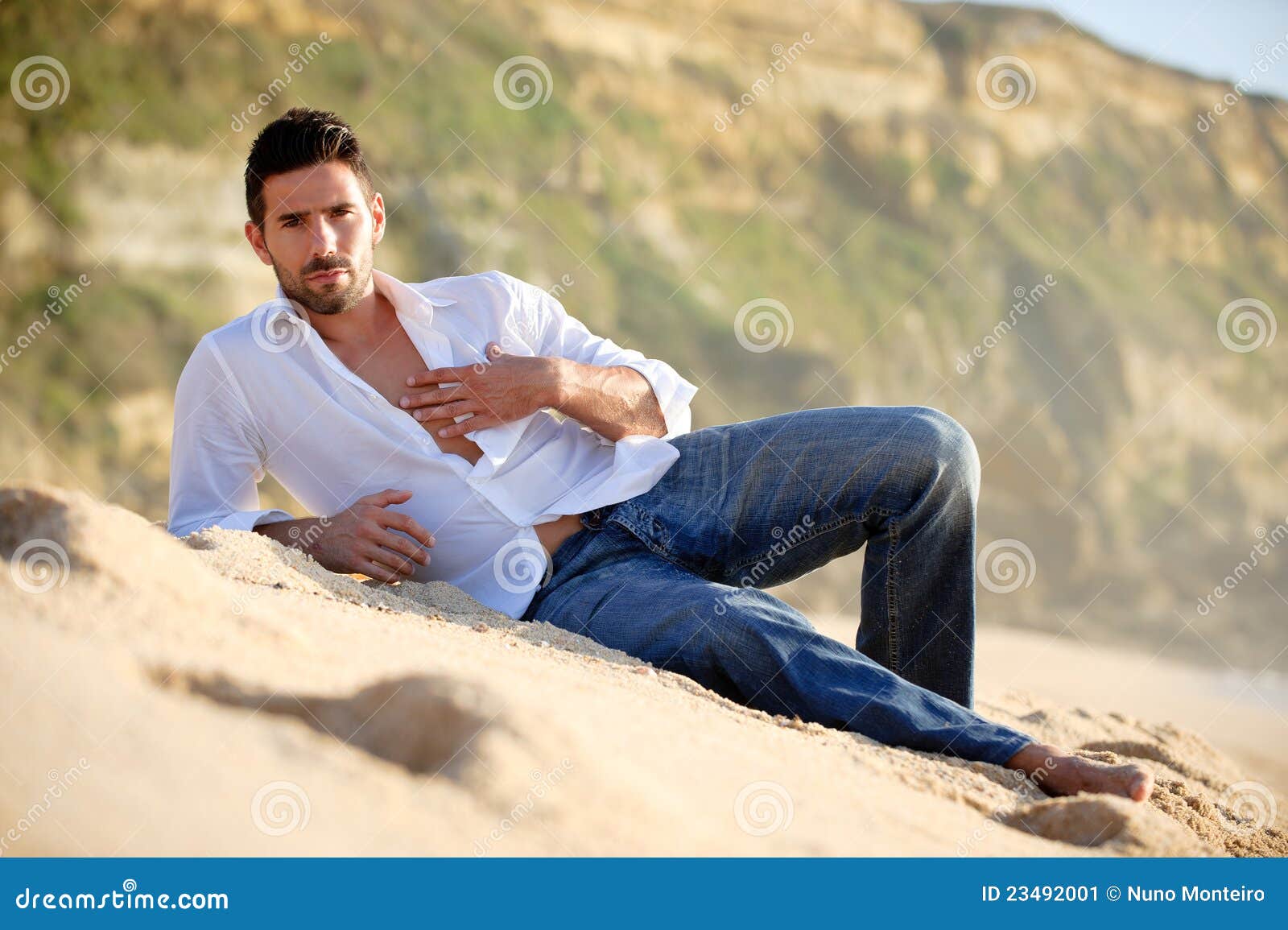 Man layed on the sand stock image. Image of sensual, dune - 23492001