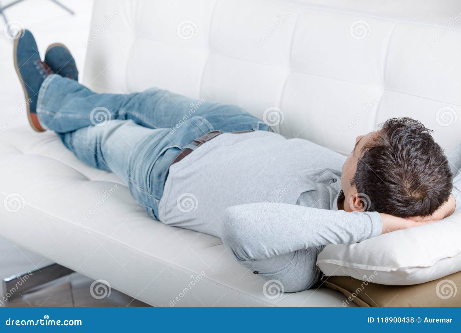 Man layed on sofa stock photo. Image of rest, asleep - 118900438