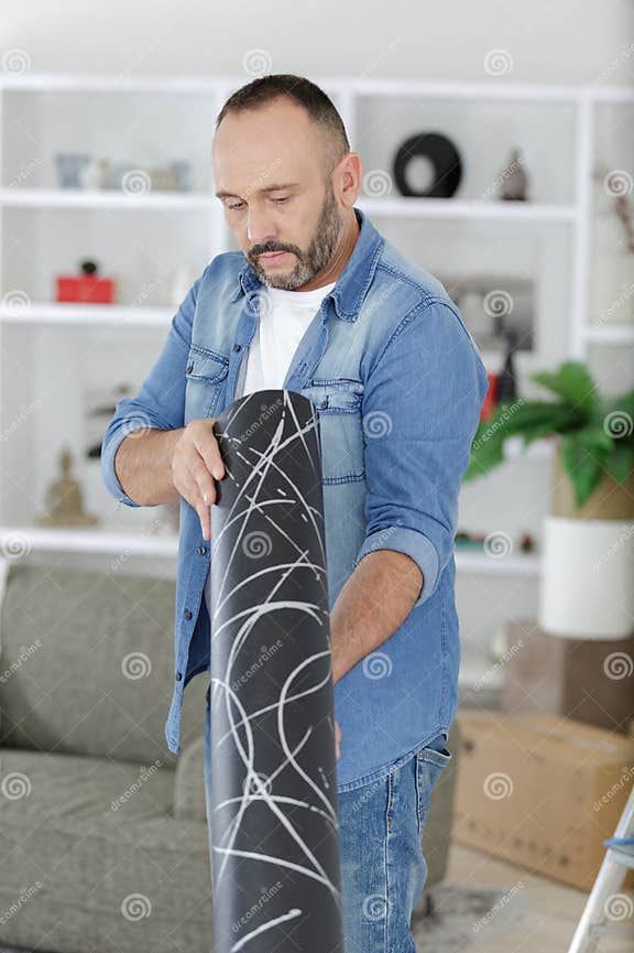 Man laying carpet stock photo. Image of manual, plan - 280479304