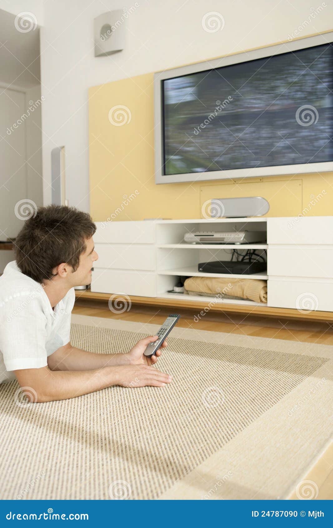 Man Laying Down on Floor Watching TV Stock Photo - Image of break ...