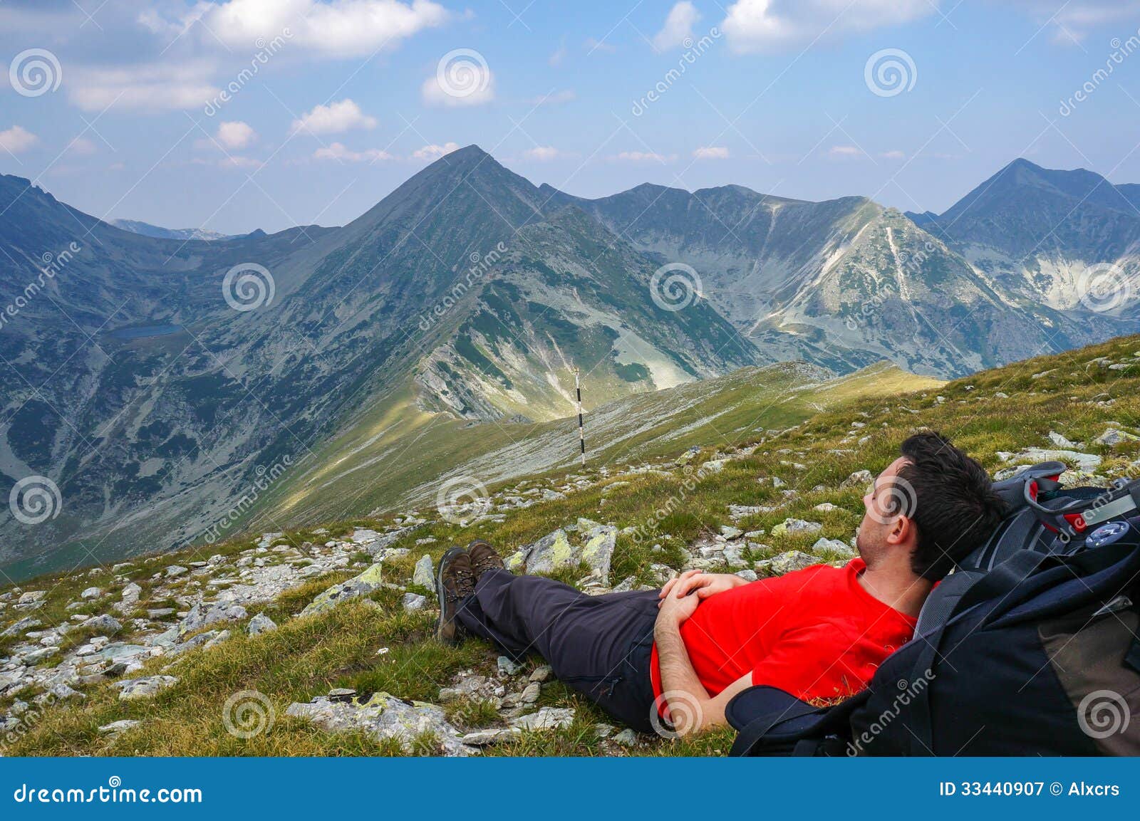 Man Laying Down the Grass on the Mountain Stock Image - Image of meadow ...
