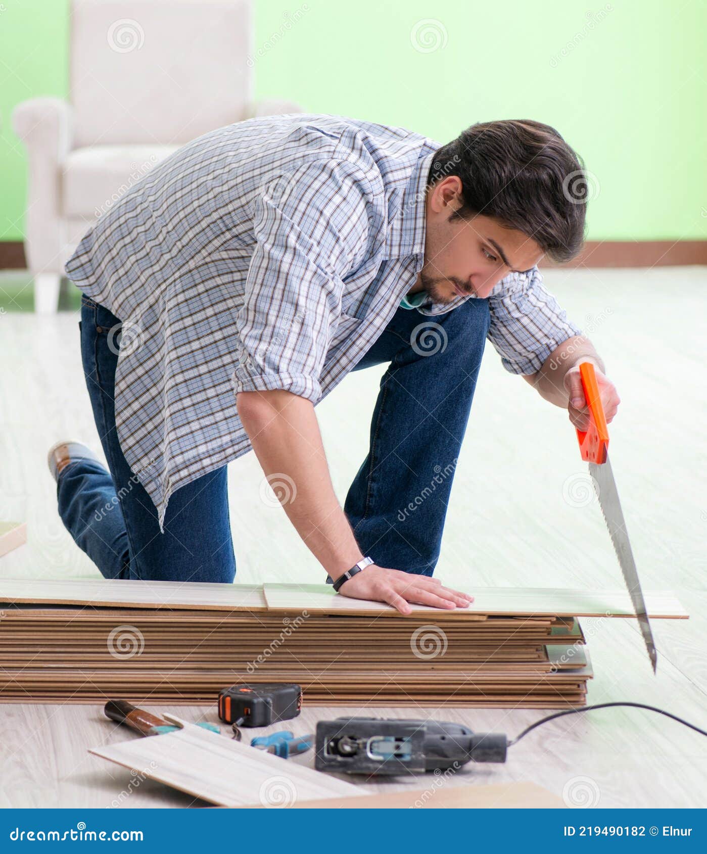 Man Laying Flooring at Home Stock Photo - Image of construction, fixing ...