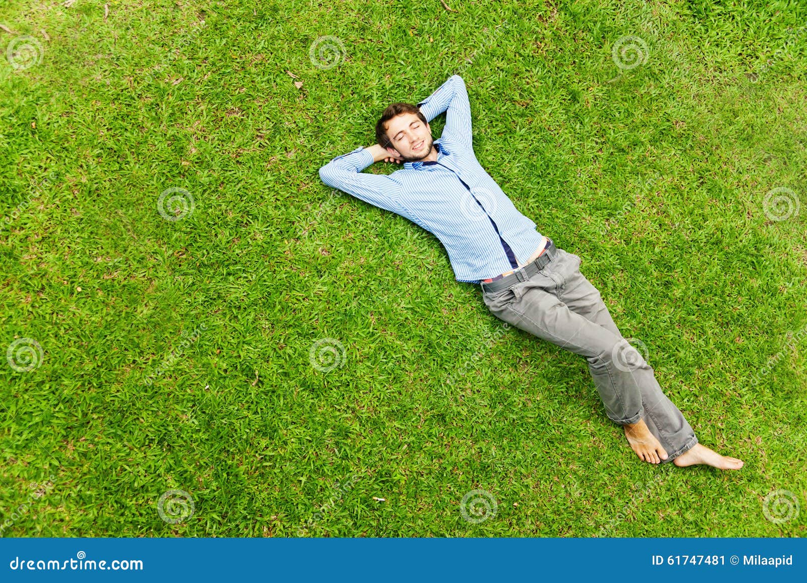 Man laying on a grass stock image. Image of freedom, natural - 61747481
