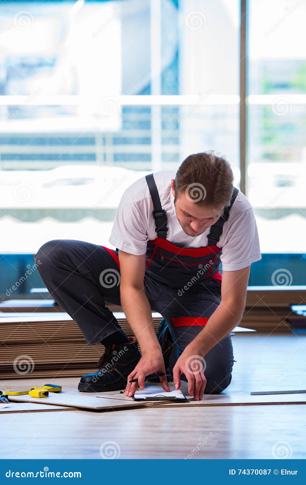 The Man Laying Laminate Flooring in Construction Concept Stock Image ...