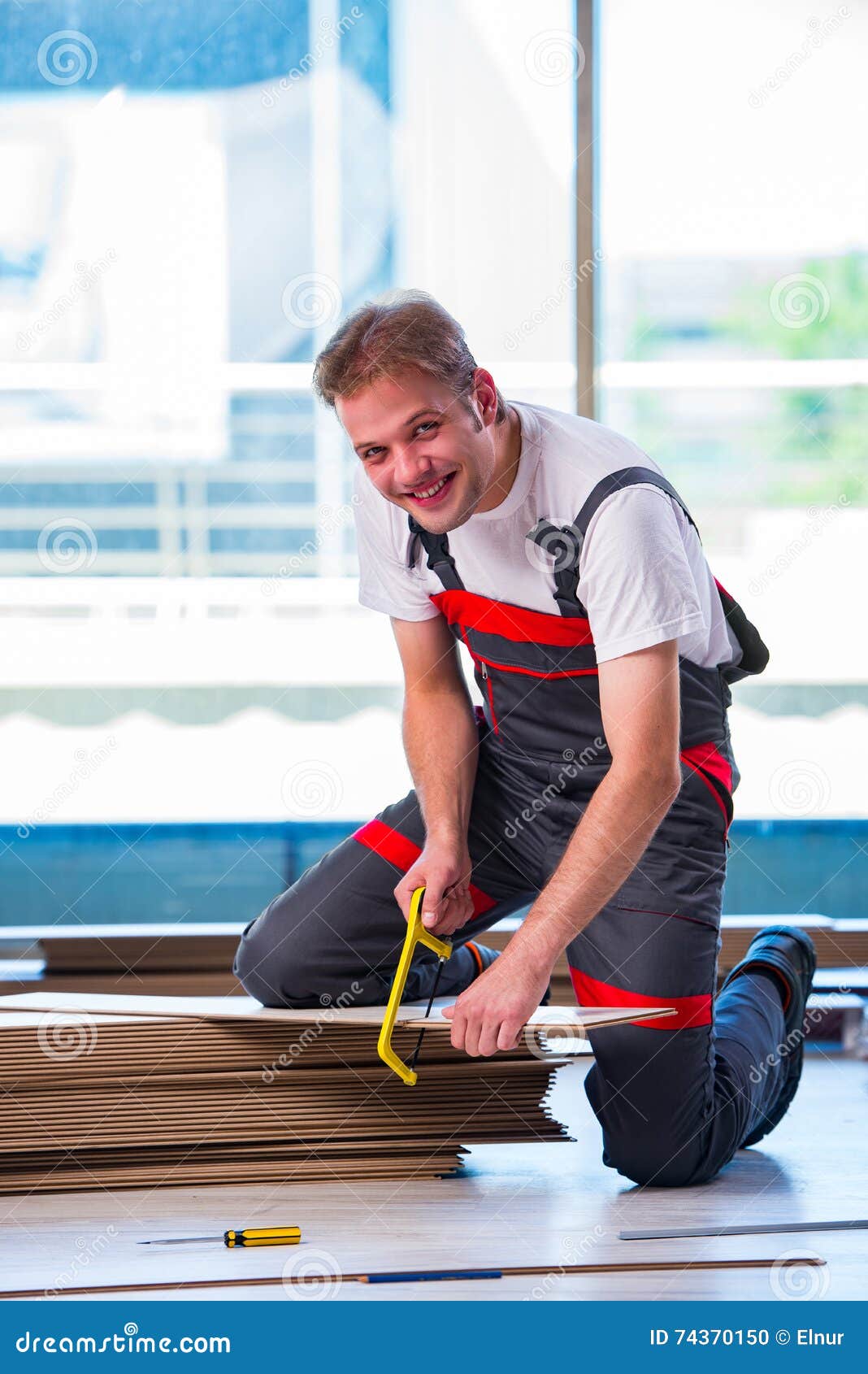 The Man Laying Laminate Flooring in Construction Concept Stock Photo ...