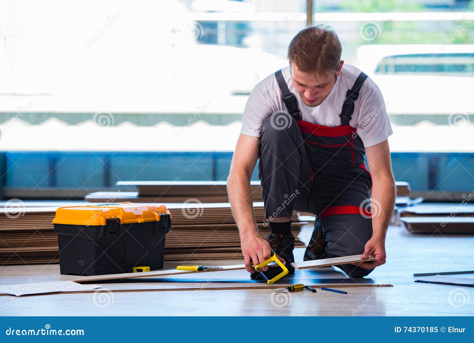 The Man Laying Laminate Flooring in Construction Concept Stock Image ...