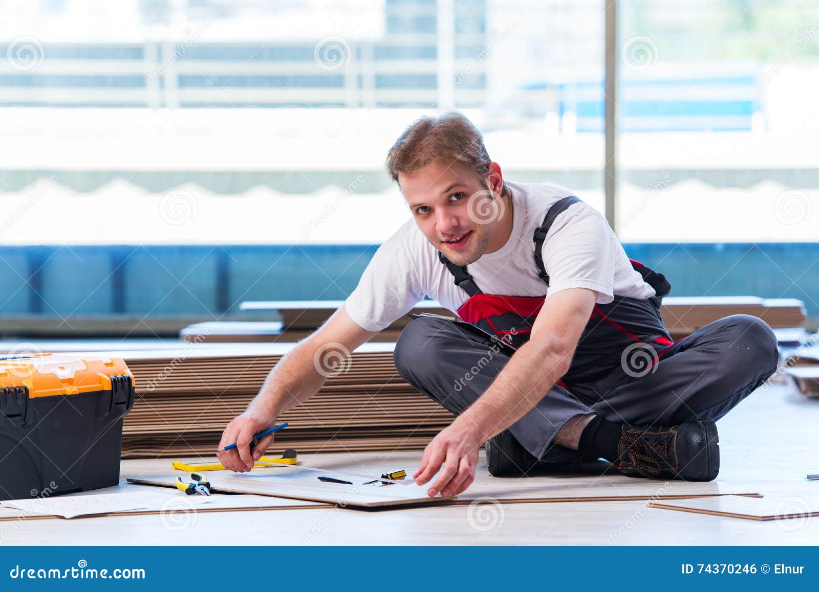 The Man Laying Laminate Flooring in Construction Concept Stock Photo ...