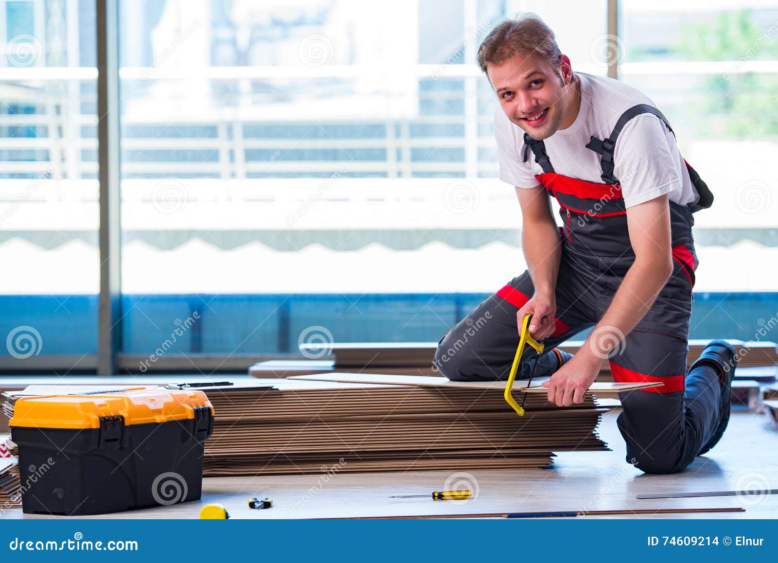 The Man Laying Laminate Flooring in Construction Concept Stock Photo ...