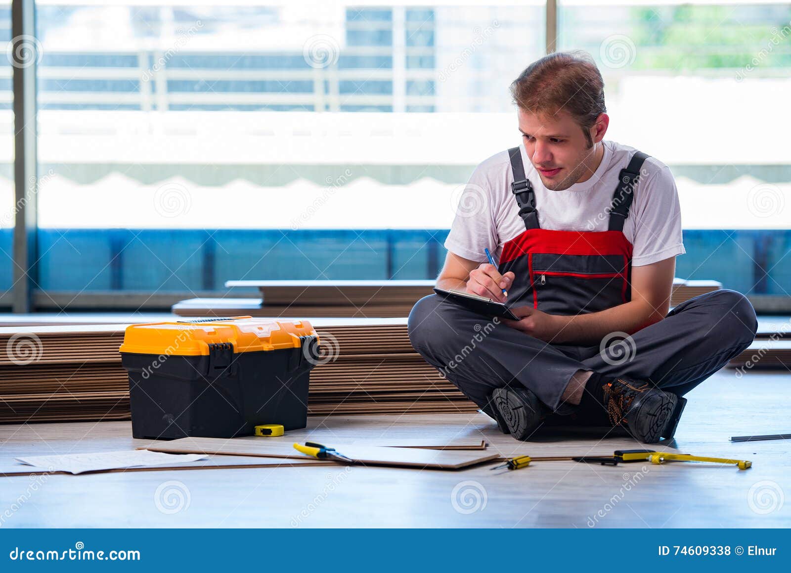 The Man Laying Laminate Flooring in Construction Concept Stock Photo ...