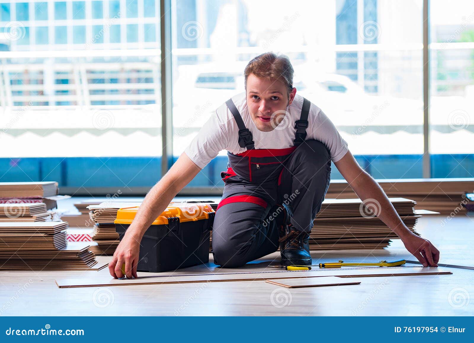 The Man Laying Laminate Flooring in Construction Concept Stock Photo ...