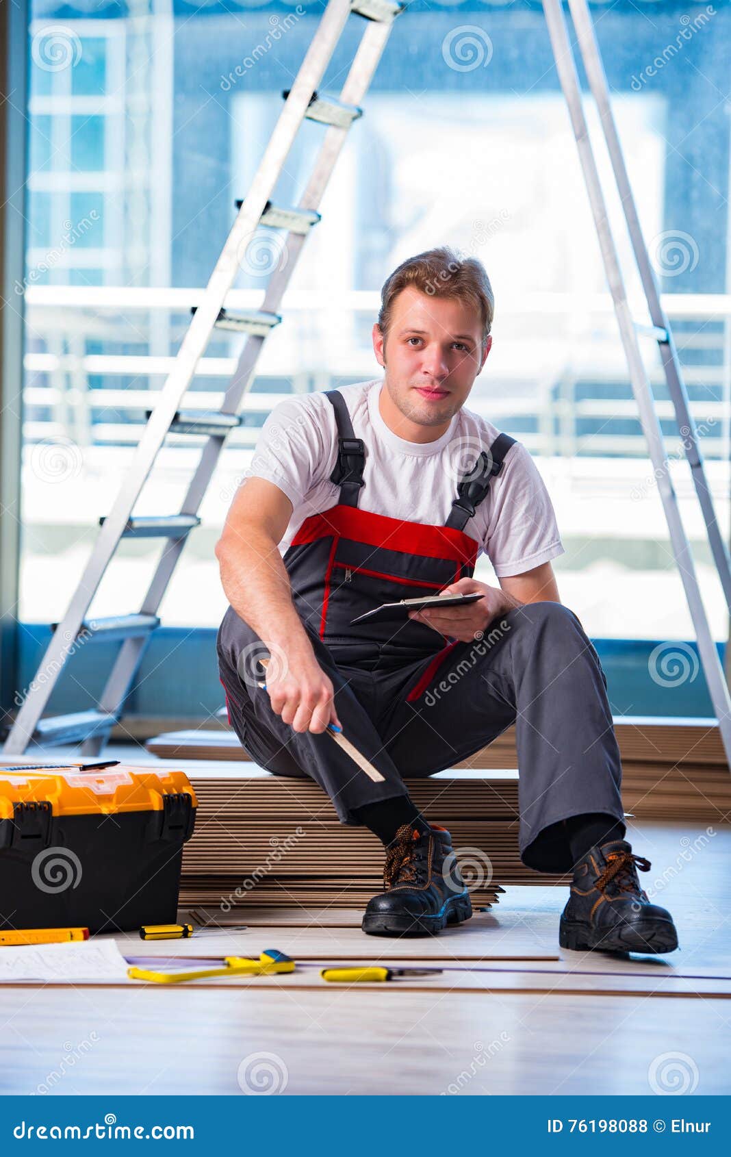 The Man Laying Laminate Flooring in Construction Concept Stock Photo ...
