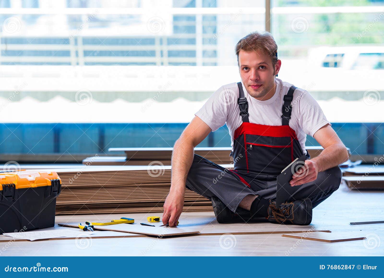 The Man Laying Laminate Flooring in Construction Concept Stock Image ...