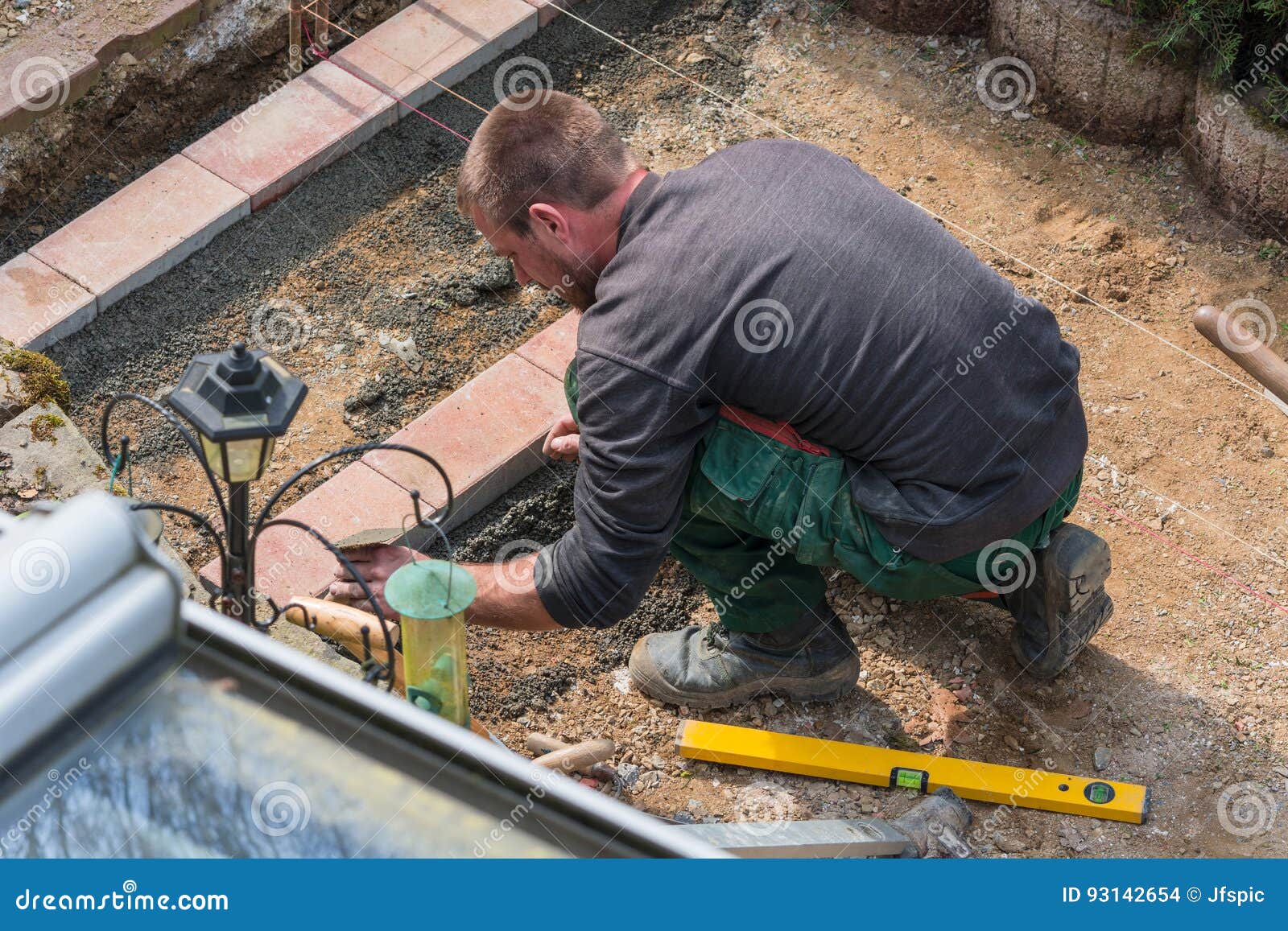 Man is Laying Paving Stones. Stock Photo - Image of pflasterer, basalt ...