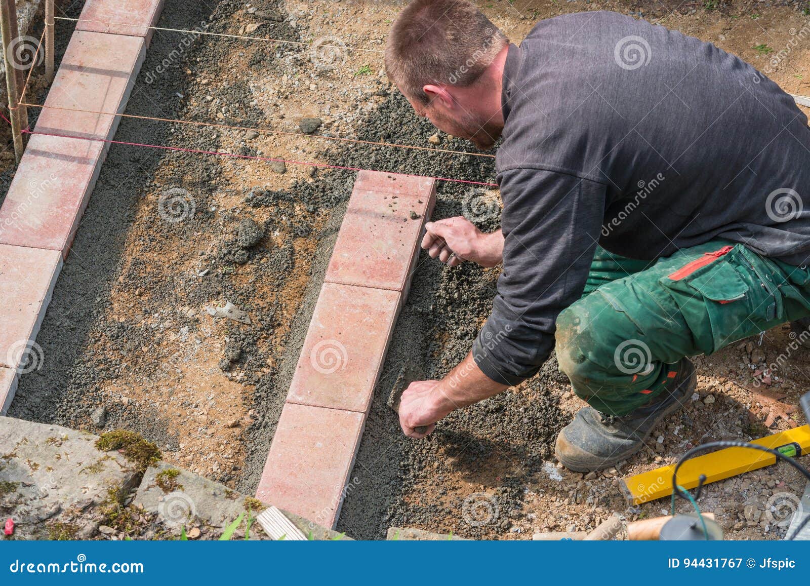 Man is Laying Paving Stones. Stock Image - Image of knocking, site ...