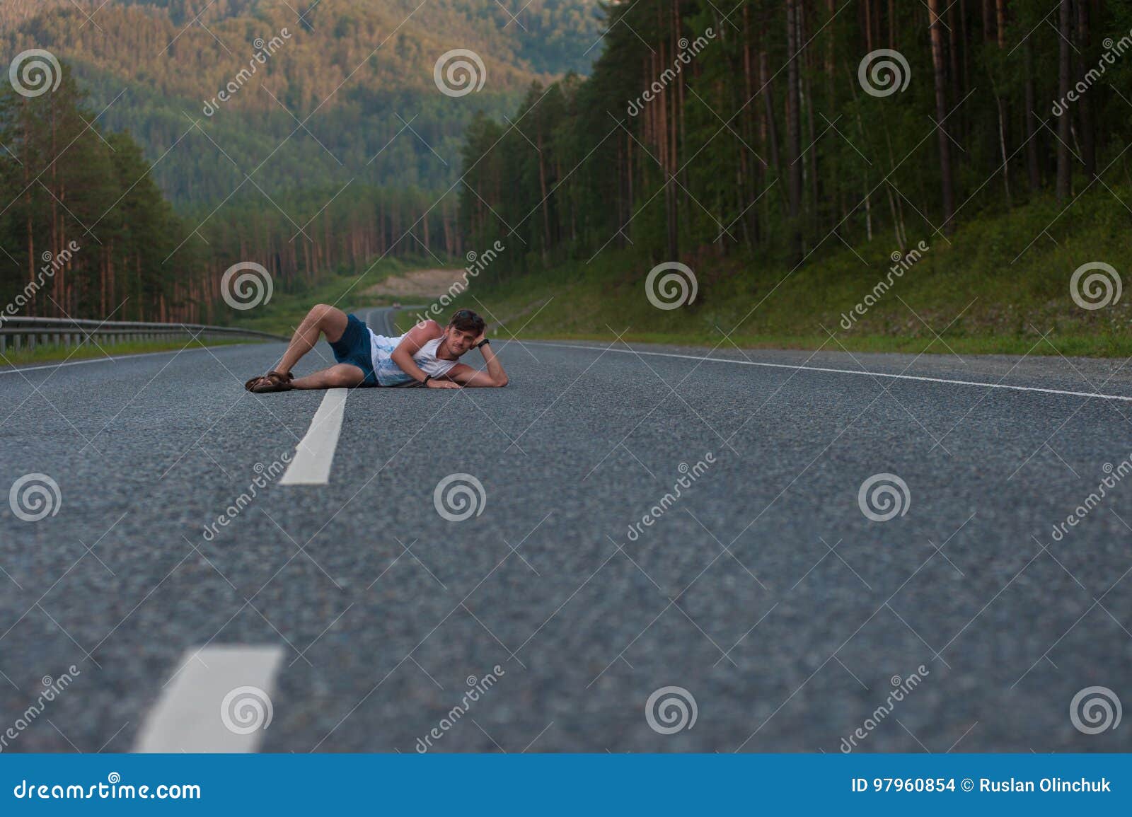 Man laying on the road stock photo. Image of rest, alone - 97960854