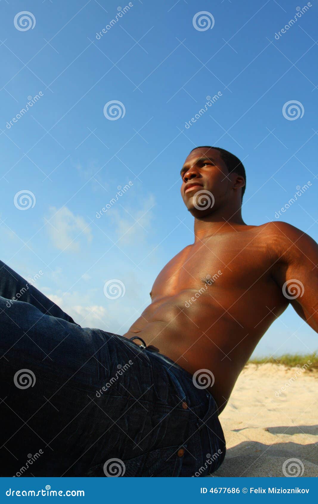 Man Laying on the Sand stock photo. Image of copyspace - 4677686