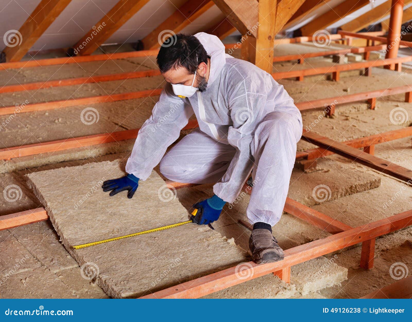 Man Laying Thermal Insulation Layer Under the Roof Stock Photo - Image ...