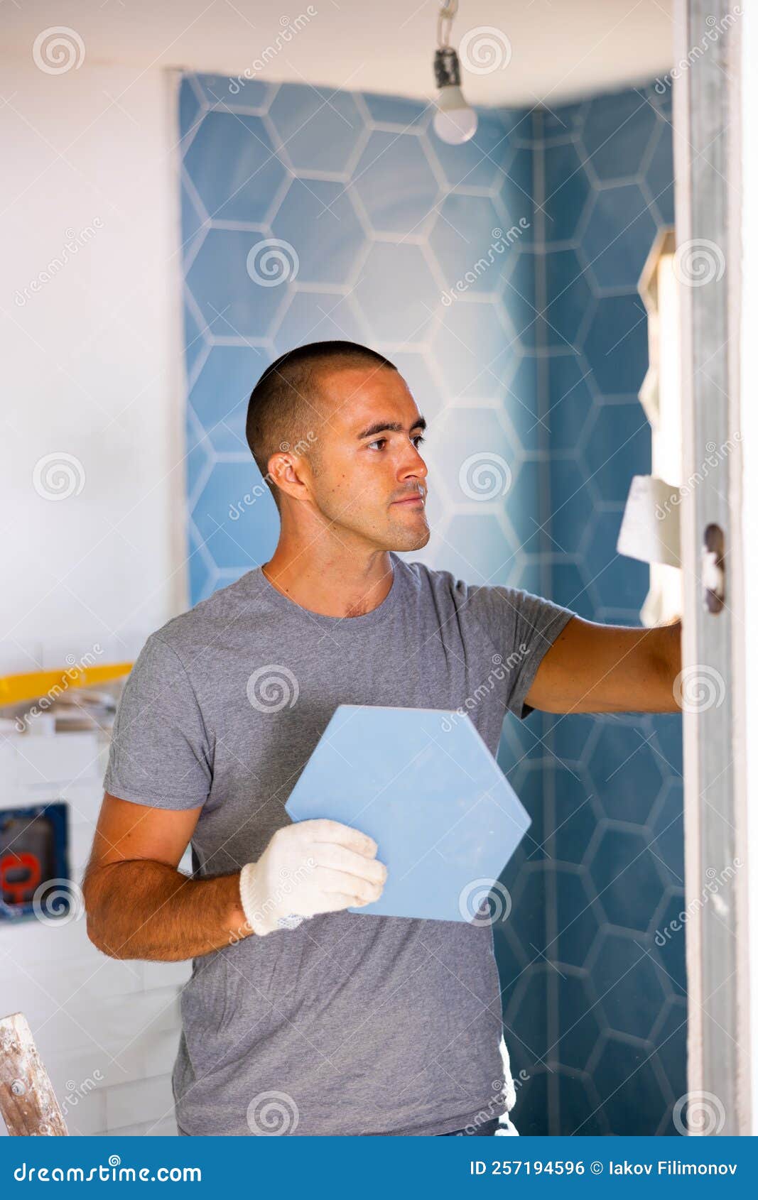 Man Laying Tile in Bathroom Stock Photo - Image of renovation ...