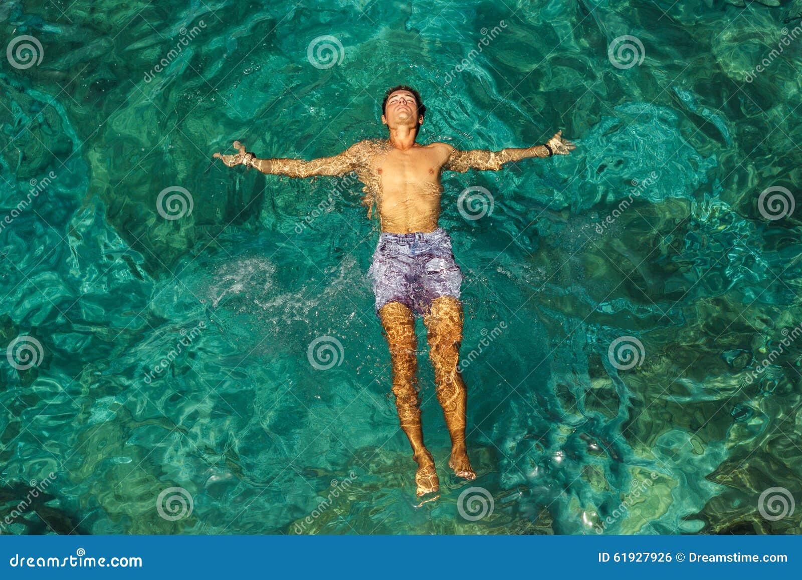 Man laying on the water stock photo. Image of summer - 61927926