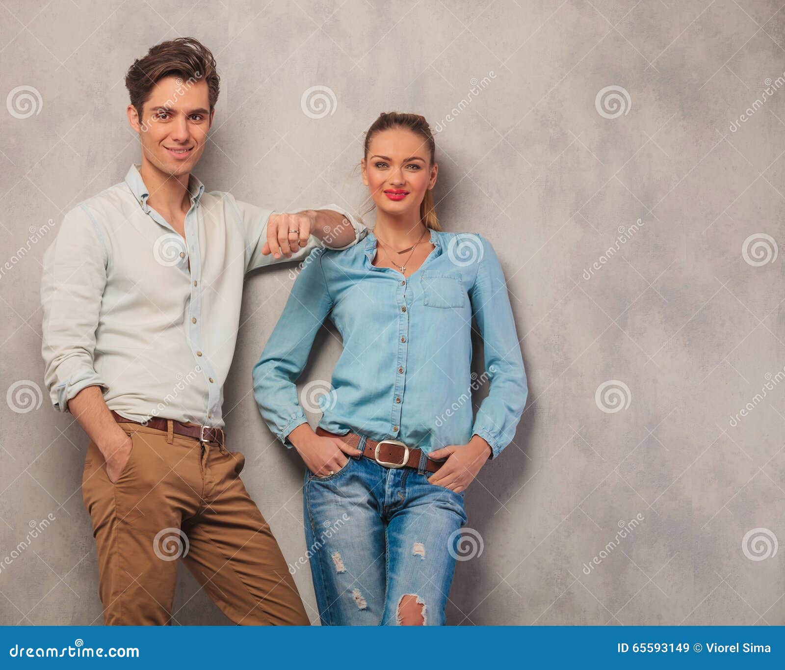 Man Lean on His Girl Shoulder while she Poses with Hands in Pock Stock ...