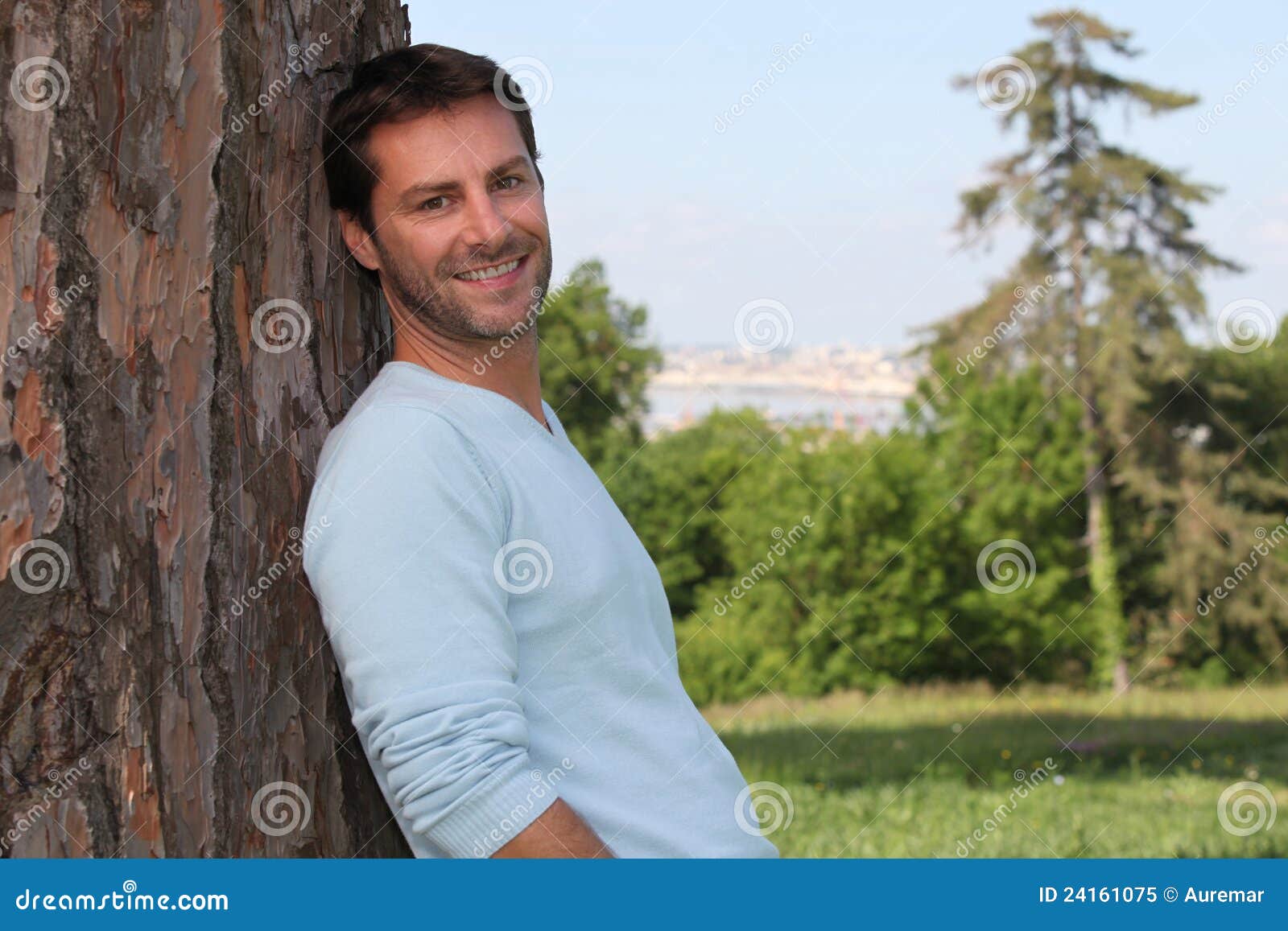 Man leaning against a tree stock image. Image of portrait - 24161075
