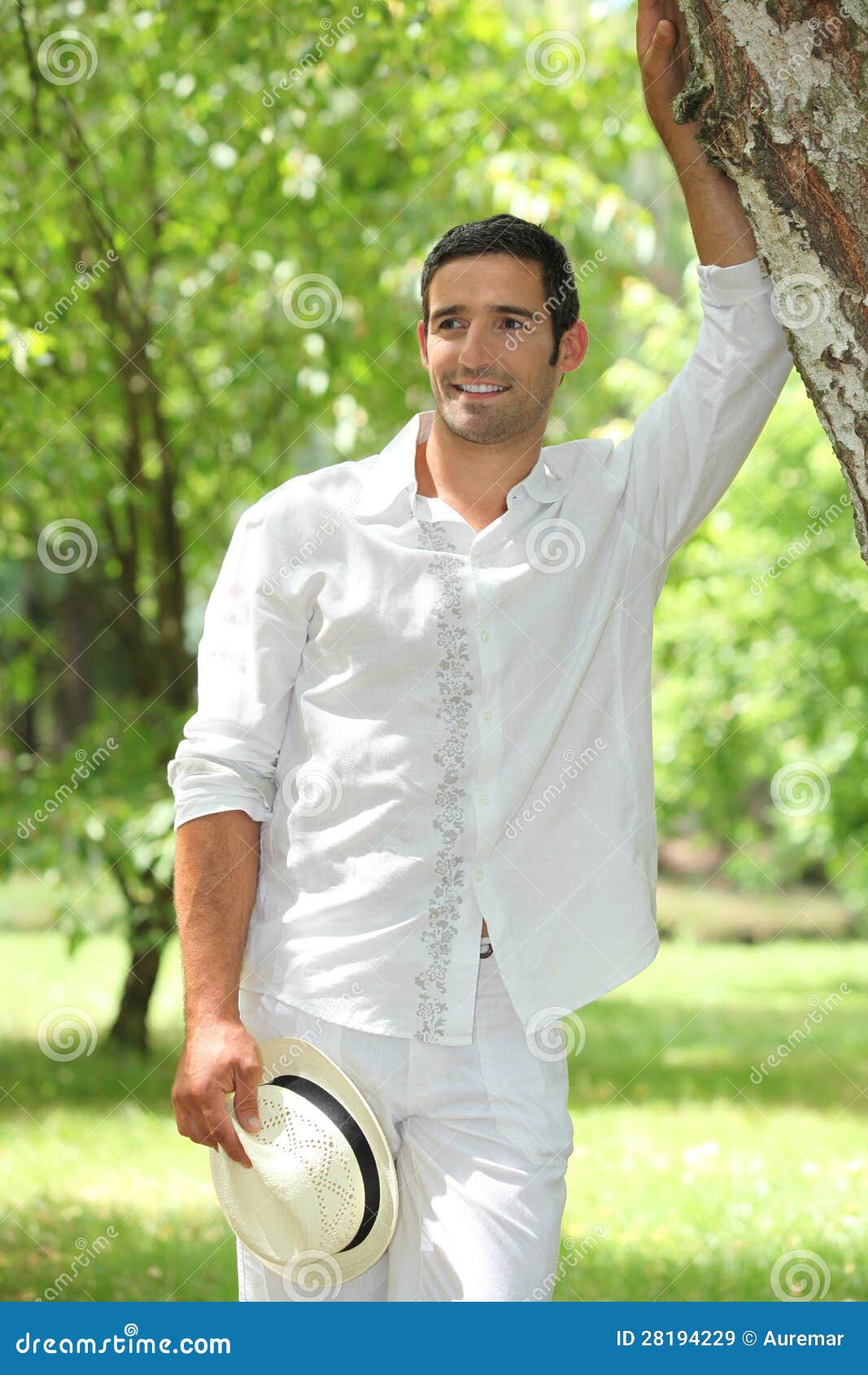 Man leaning against tree stock image. Image of confident - 28194229