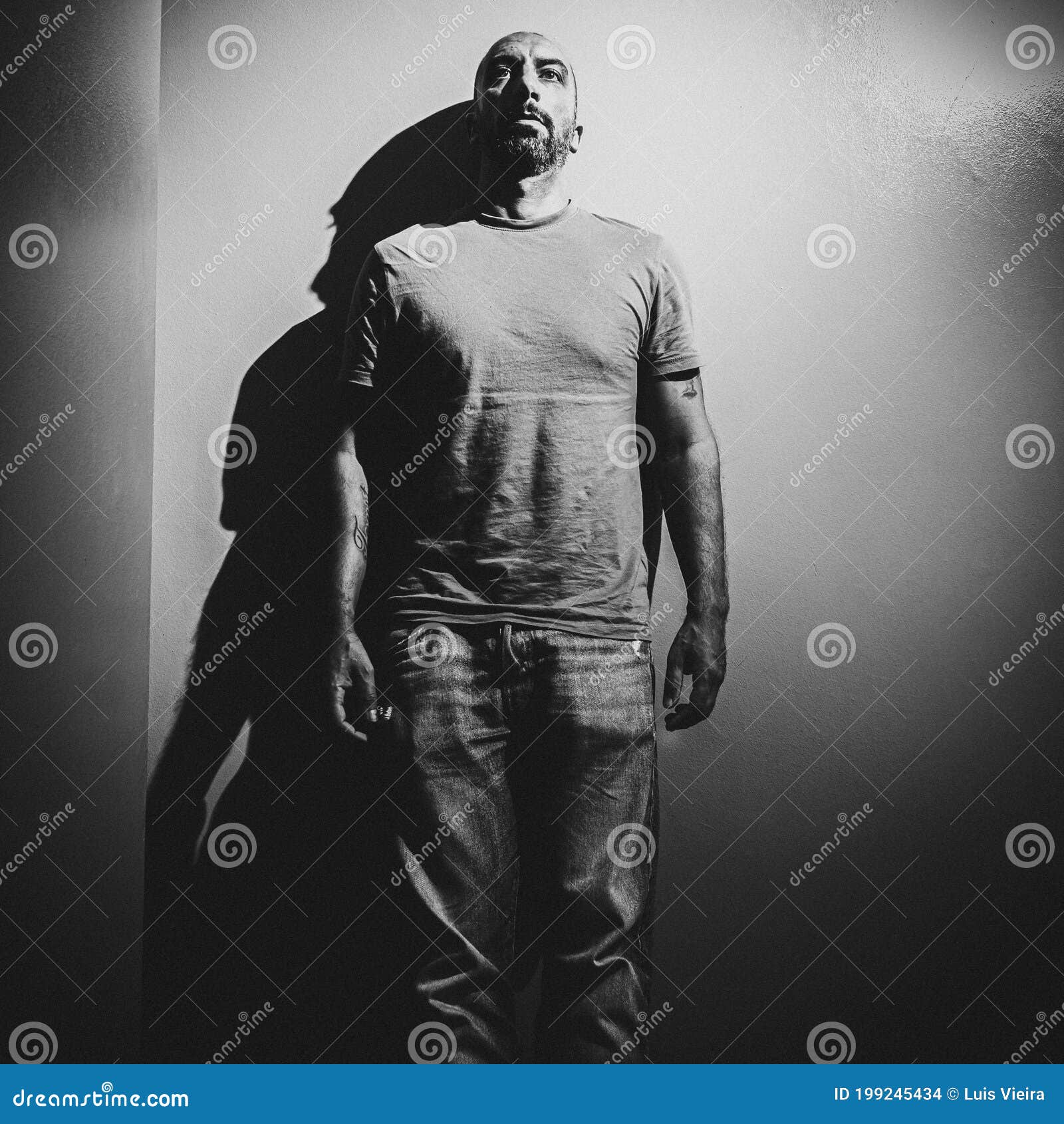 A Man Leaning Against the Wall Stock Photo - Image of young, head ...