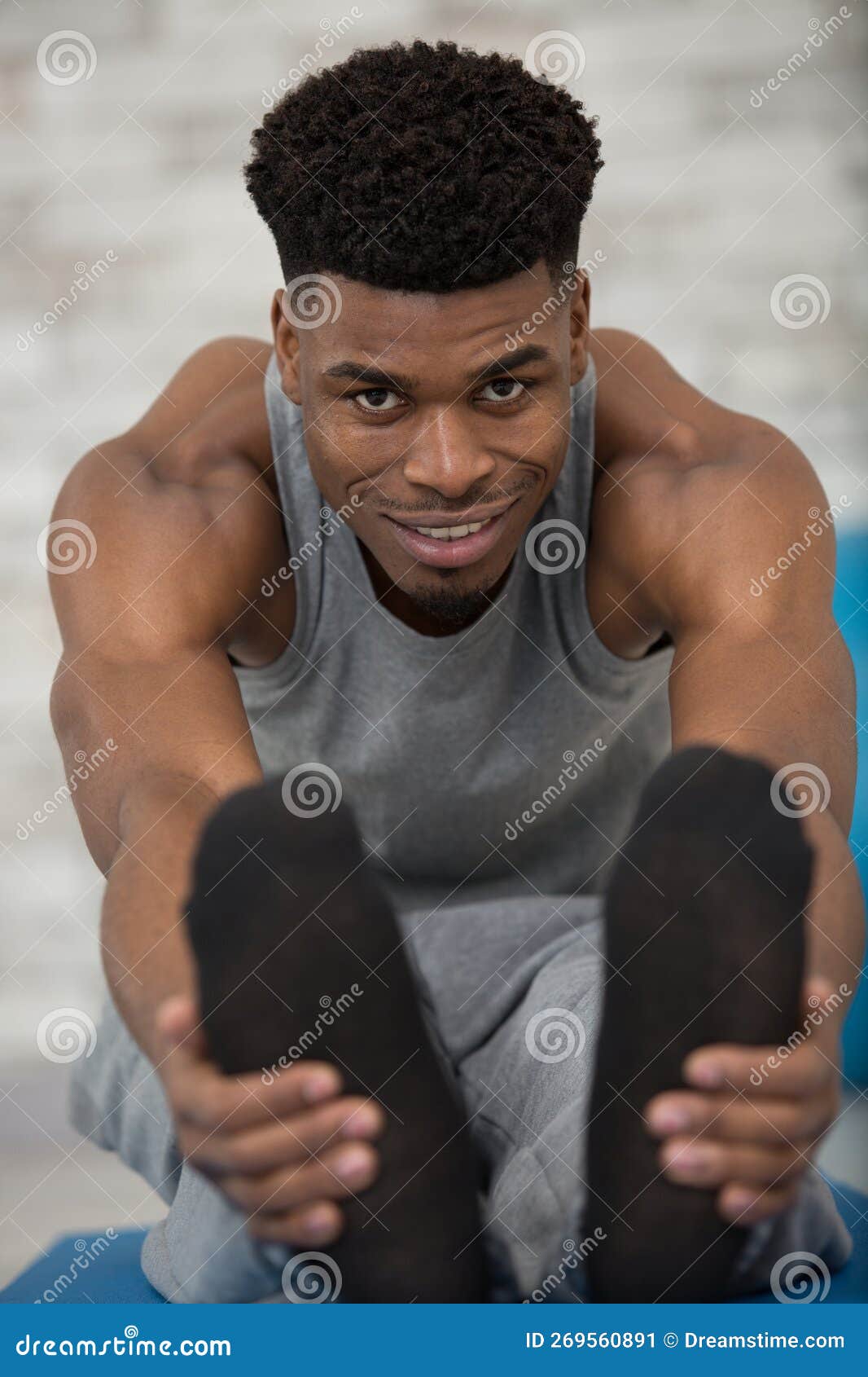 Man Leaning in Forward Stretch and Holding Feet Stock Image - Image of ...