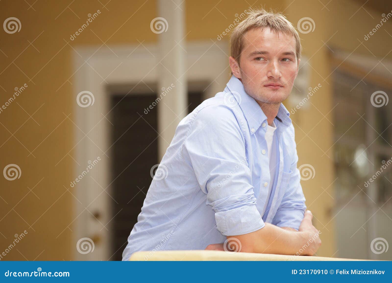 Man leaning on the ledge stock photo. Image of horizontal - 23170910