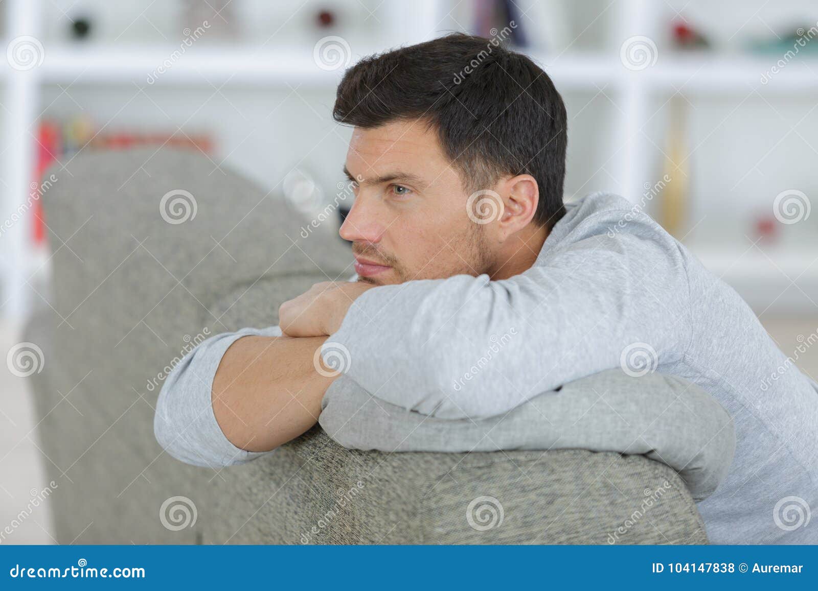Man leaning over back sofa stock photo. Image of relaxation - 104147838