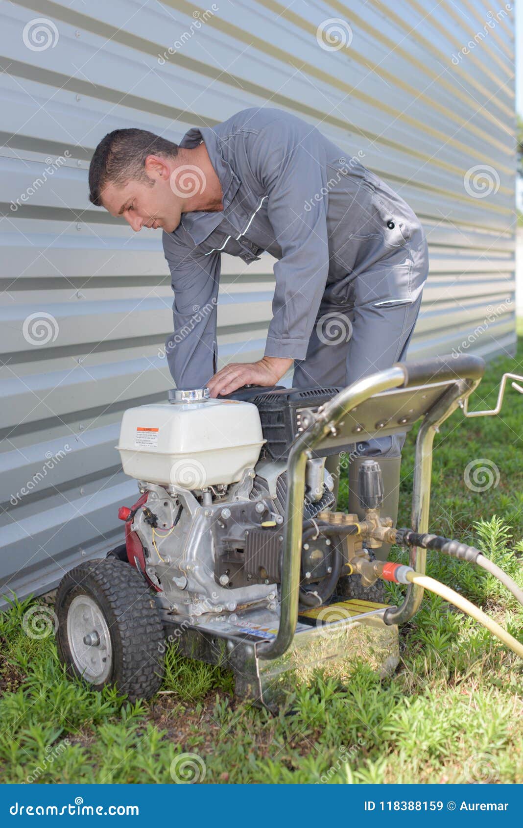 Man leaning over generator stock image. Image of portable - 118388159