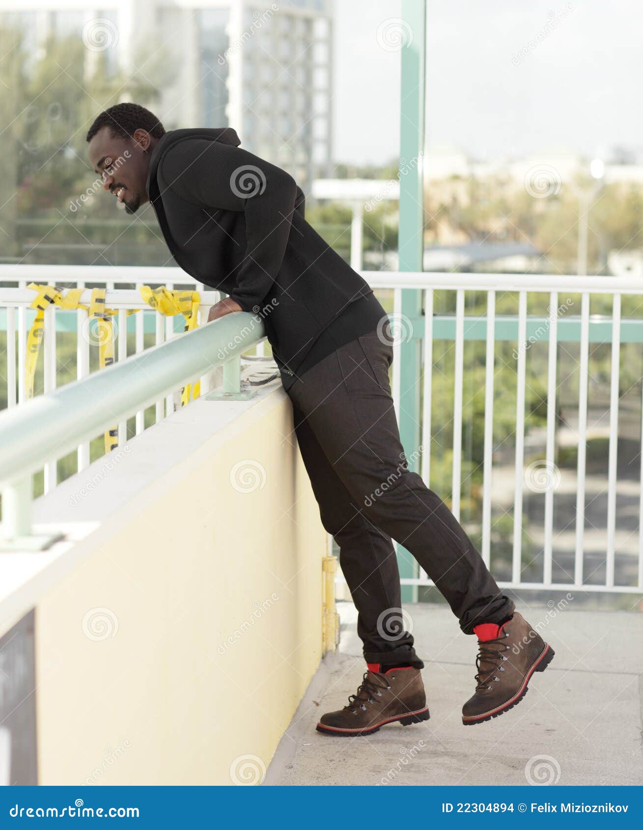 Man leaning over the ledge stock photo. Image of looking - 22304894 Man leaning over the ledge stock photo. Image of looking - 22304894